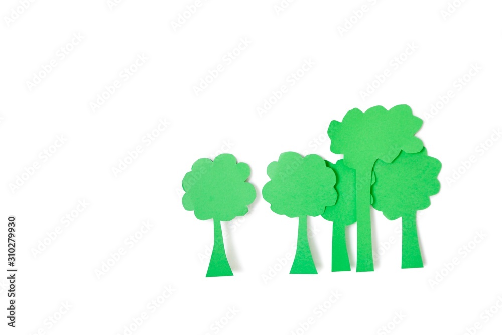 Paper cut outs of green trees over white background Stock Photo | Adobe ...
