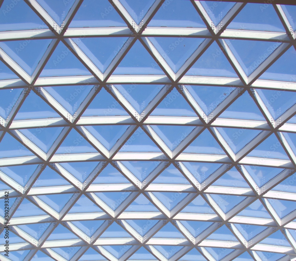 Large, modern design glass skylight at an airport. The beams form ...
