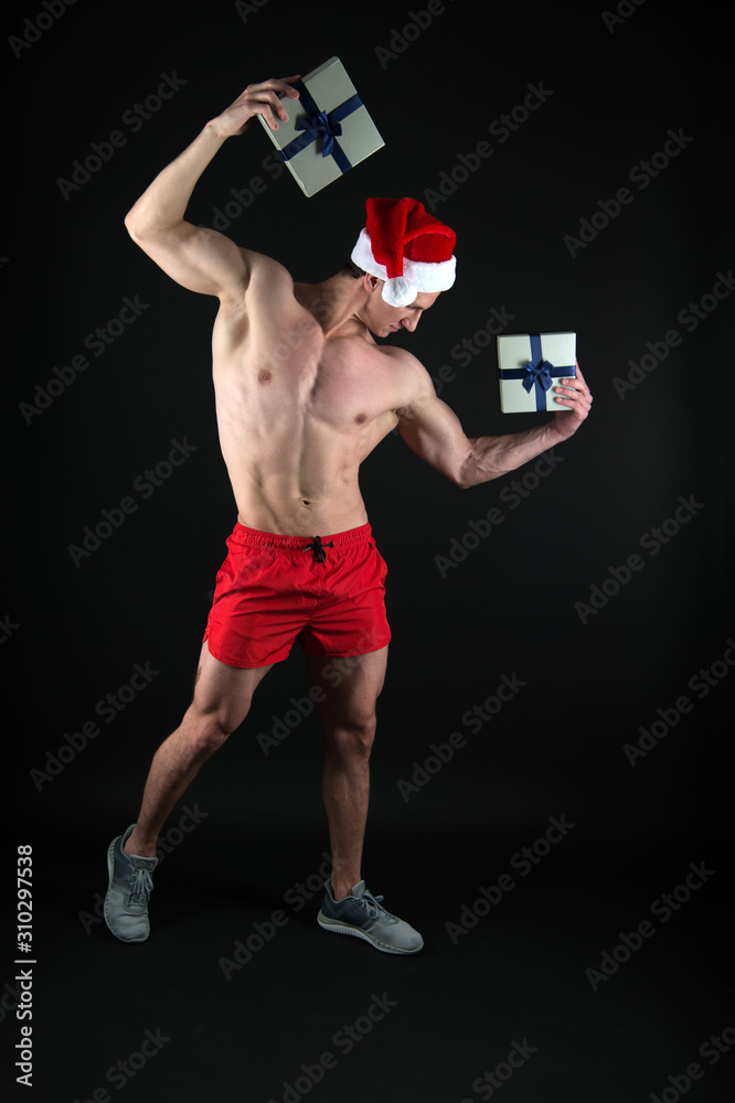 Strong Santa. Muscular man wear santa claus hat. Bodybuilder on black ...