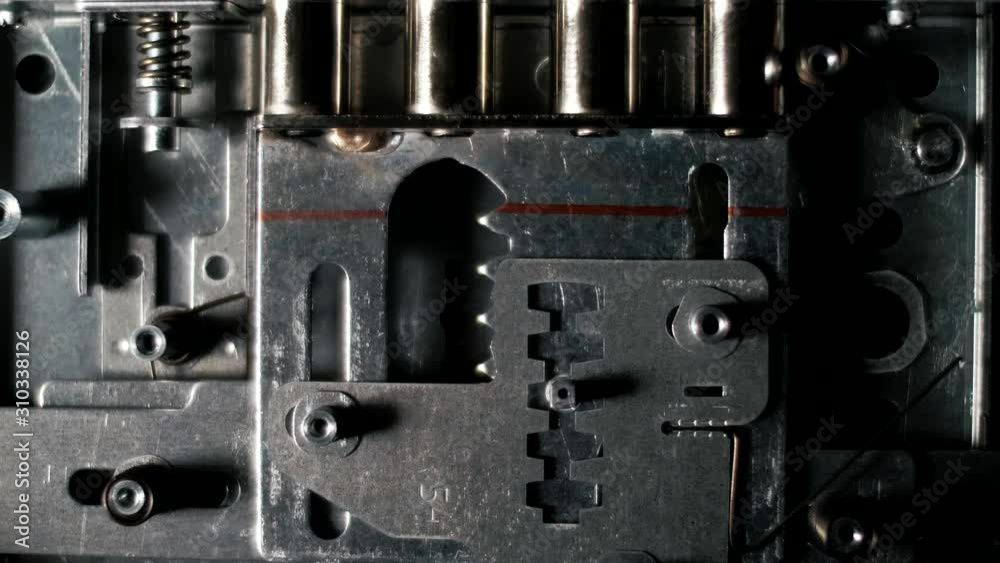 The internal mechanism of the metal lock that opens the door and opens ...