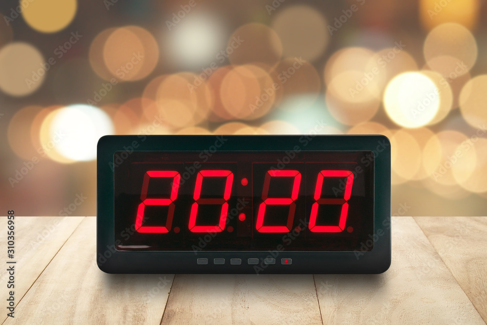 Poster red led light illuminated numbers 2020 on digital electric alarm ...