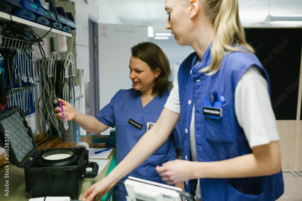 Female engineers checking hospital equipment Stock Photo | Adobe Stock