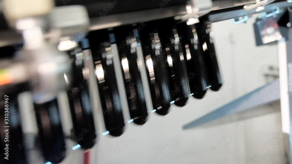 Blowing plastic bottles from PET preform blanks. A fragment of conveyor ...