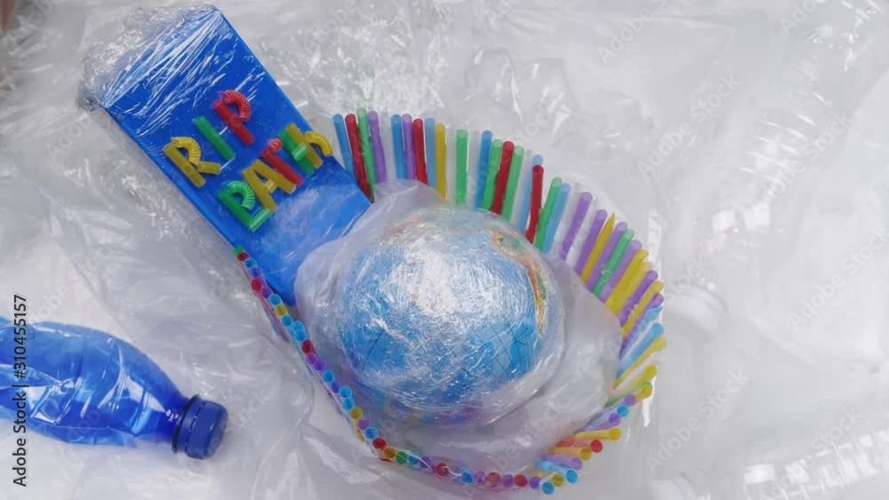 The funeral of the earth in plastic trash. World Environment Day. The ...
