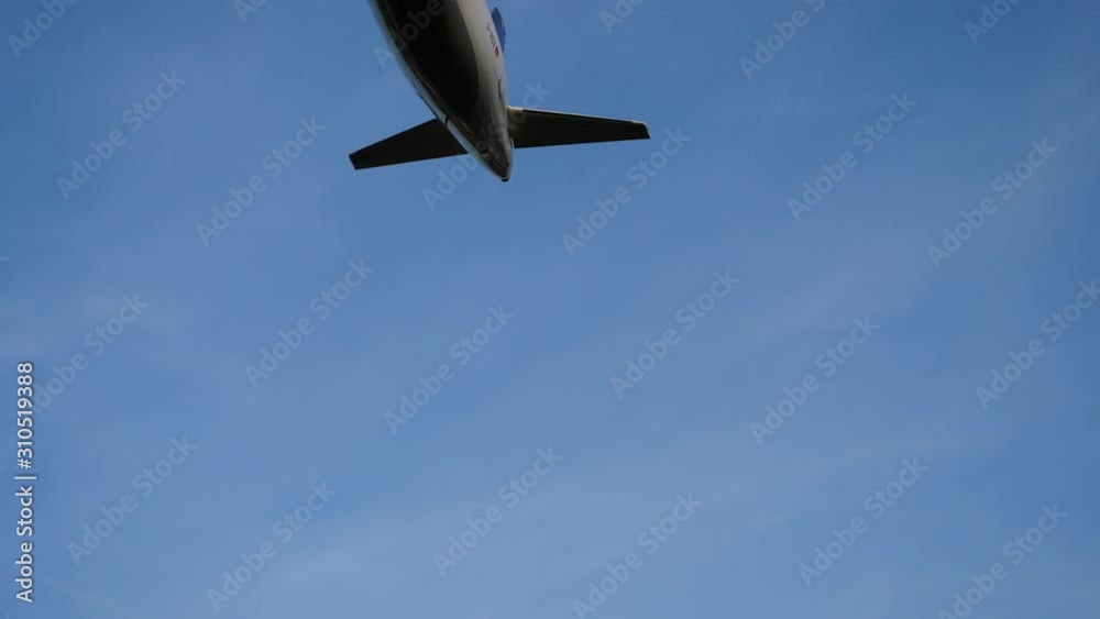 Landing approach of an airplane on runway Northwest at Frankfurt ...