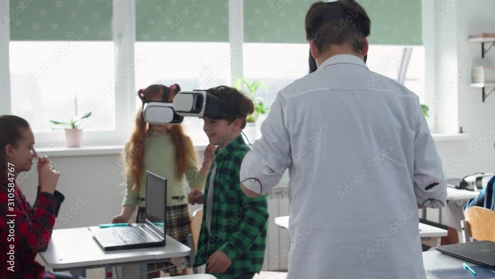 interactive education at modern school, children in virtual reality ...