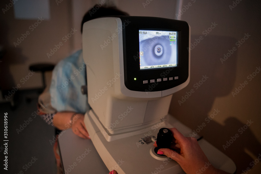 Checking eyesight in a clinic of the future, young girl. Ophthalmology ...