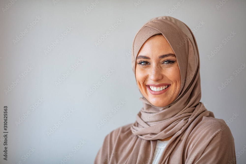 Woman in traditional Muslim clothing, smiling. Woman headshot looking ...