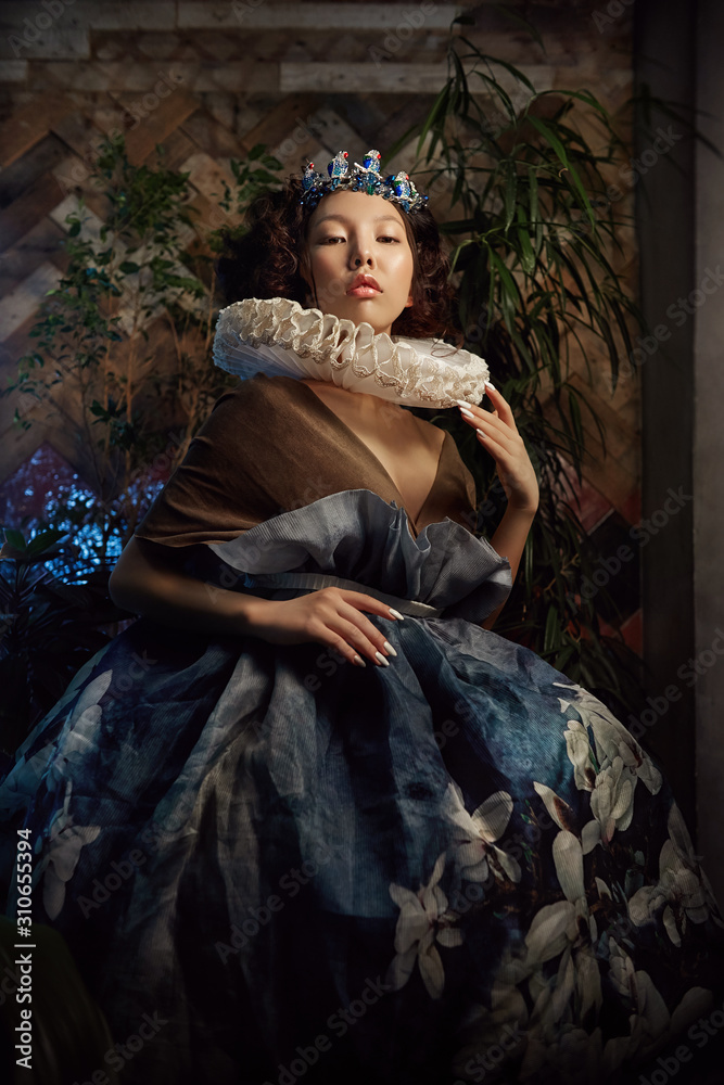 Art portrait of a girl Princess Queen in foliage and greenery, fabulous ...