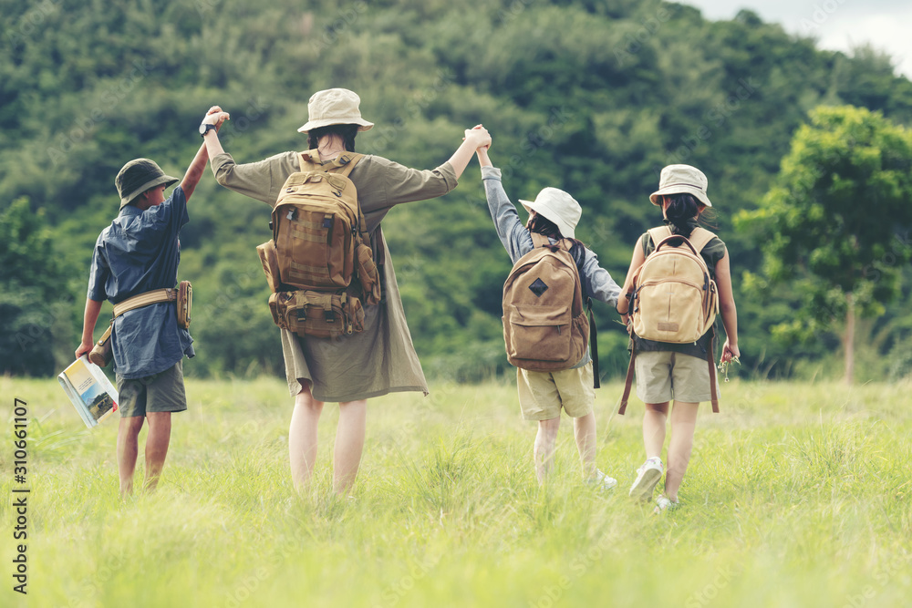 Group asian family children checking map in the jungle adventure and ...