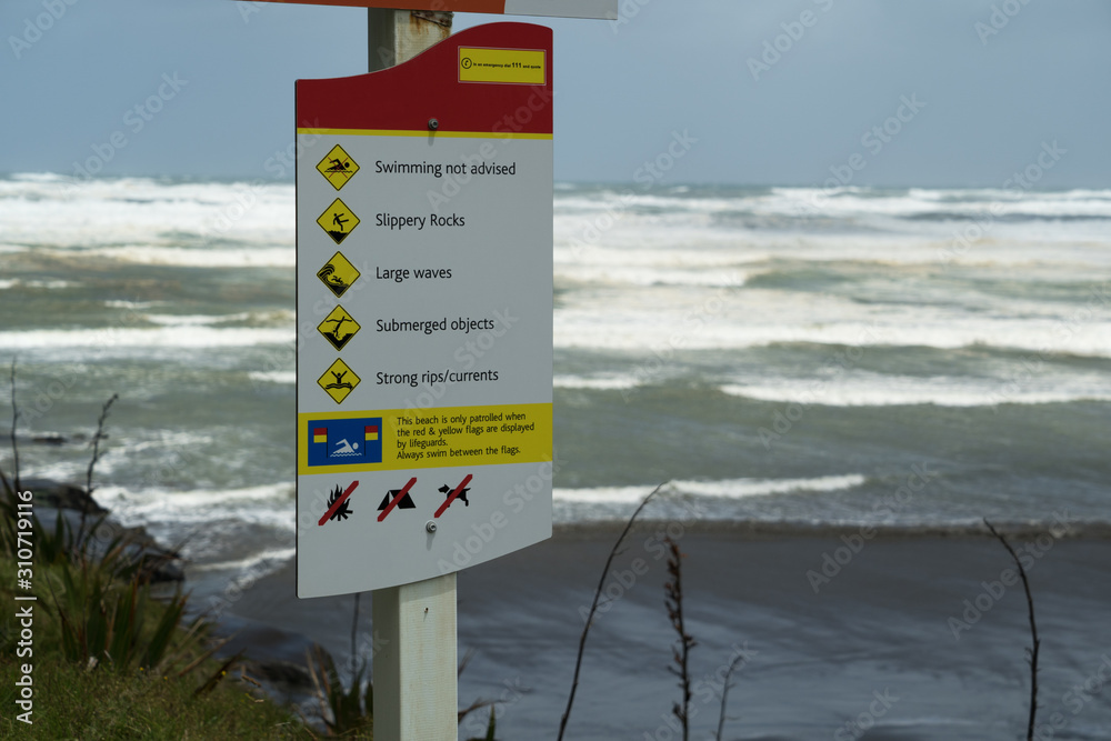 Beach warning safety sign at a dangerous beach for swimmers. Stock ...