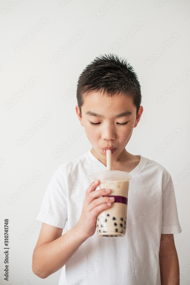 Happy Asian Boy Drinking Bubble Tea or Boba Stock Photo | Adobe Stock