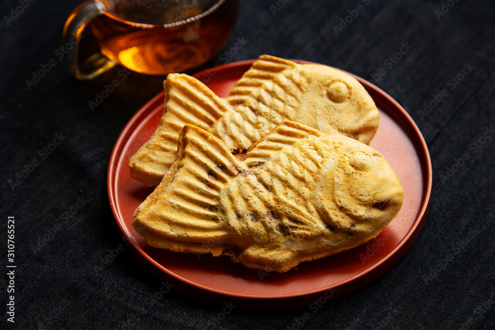 Taiyaki is Japanese traditional fish shaped cake with sweet red bean inside Stock Photo | Adobe ...