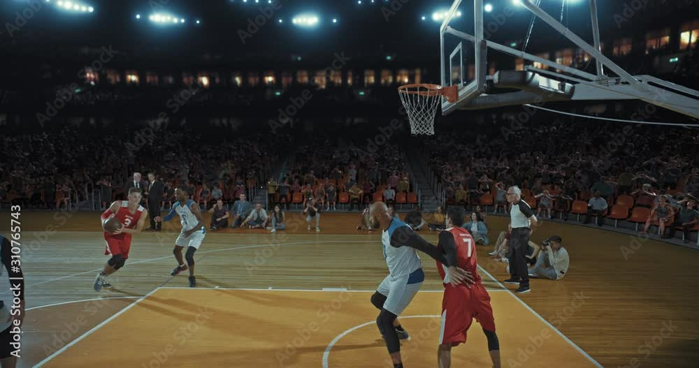 Basketball players on big professional arena during the game. Tense ...