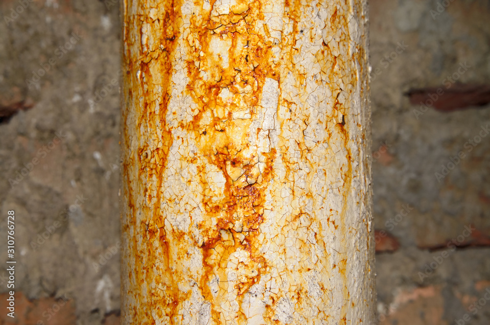 Rust and corrosion of old painted on the pipe. Vertical pipe in the ...