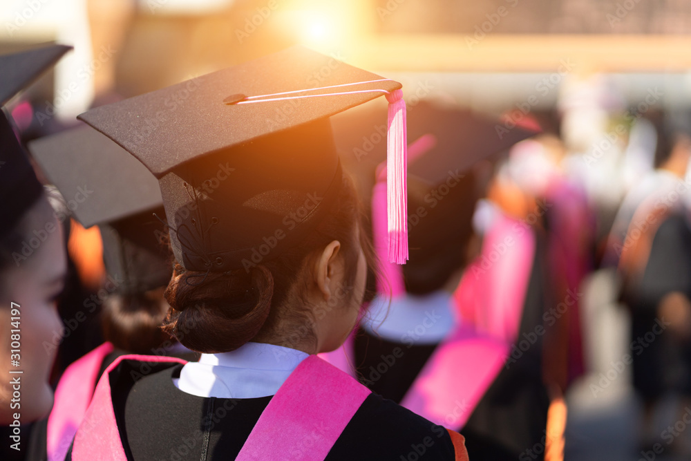 Soft selective focus rear view of the graduates in the graduation ...