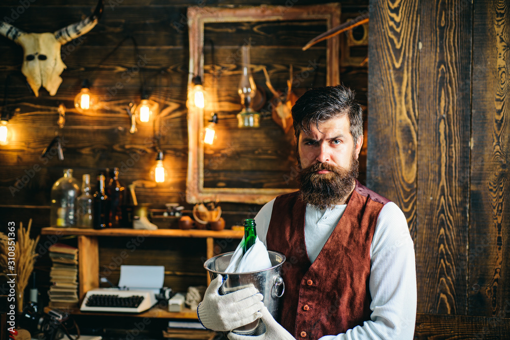 Servant. Handsome barman. Handsome bearded barman with a long beard and ...