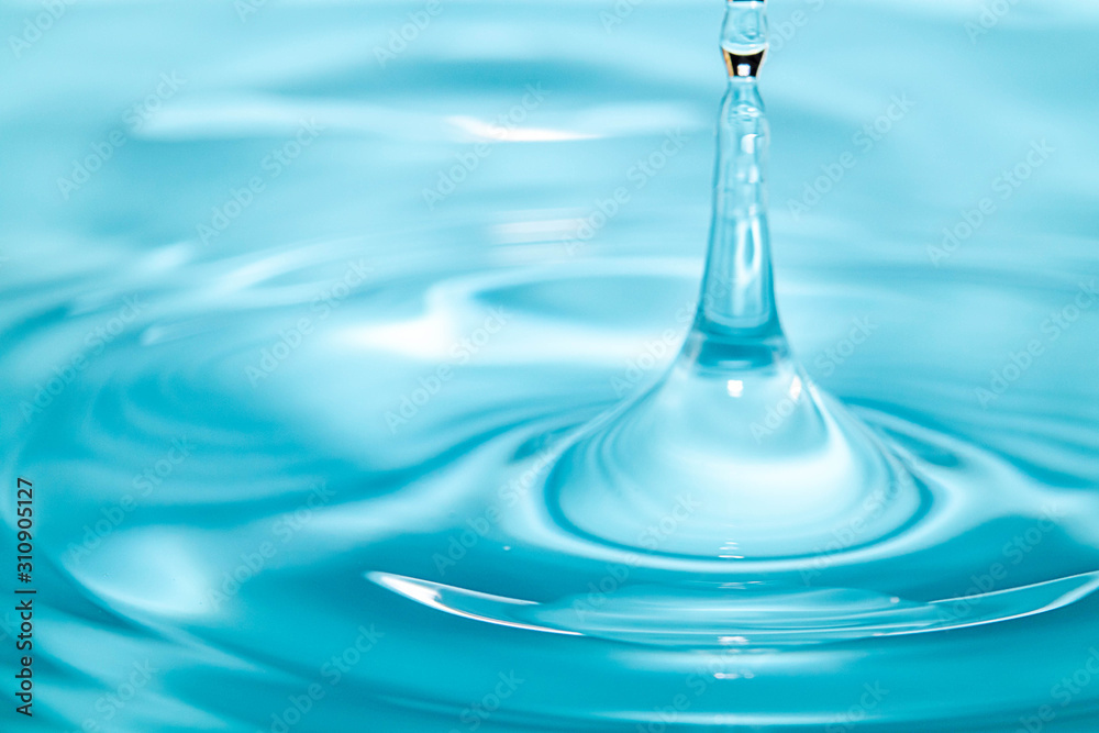 Closeup Water drop falling on the surface of the water and beautiful ...