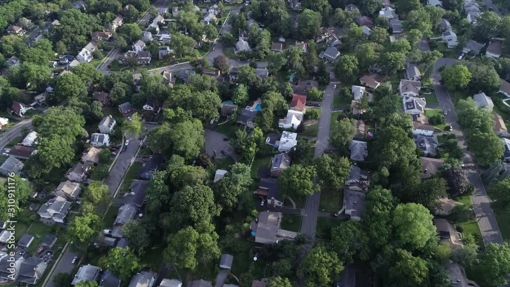 Iconic 4K aerial of a typical American suburbs neighborhood in summer ...