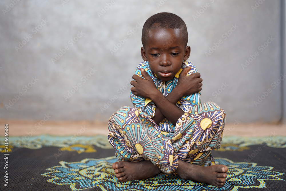 Sad little African boy feels sad, in despair and lonely Stock Photo ...