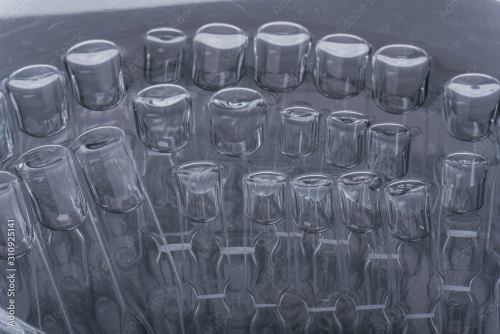 Glass medical ampoule vial for injection. Medicine is liquid sodium ...