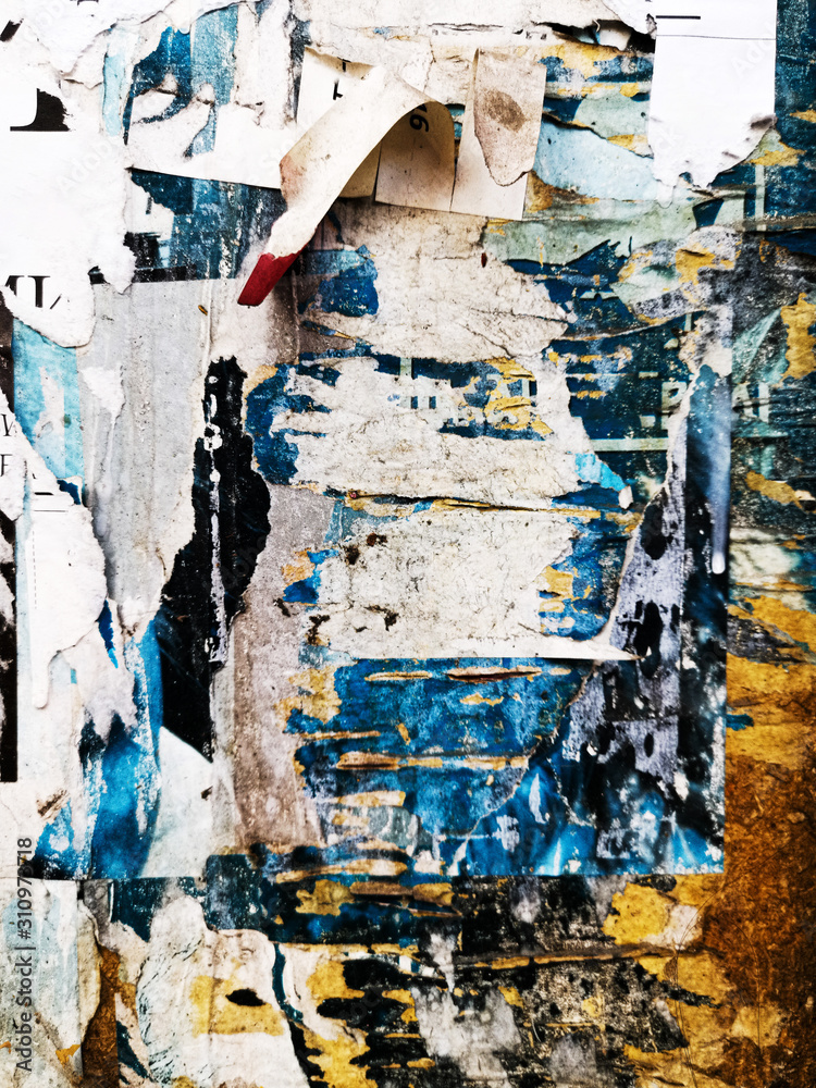 Layers of vintage posters glued and torn with time to the wall Stock ...