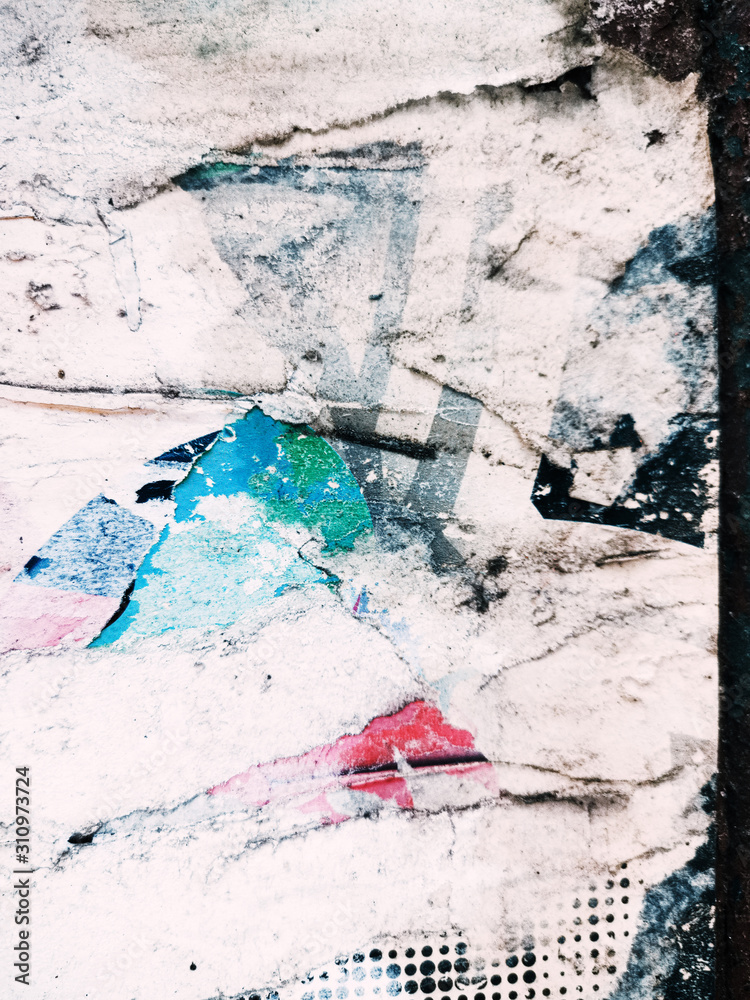 Layers of vintage posters glued and torn with time to the wall Stock ...