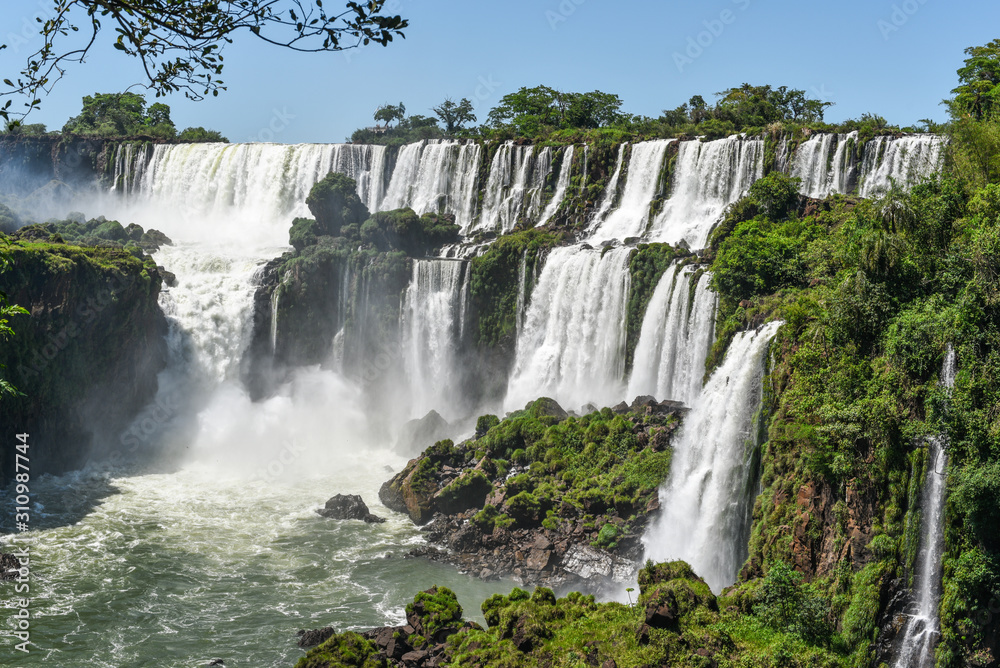 Famous Iguazu waterfalls with beautiful clouds. Declared a World ...