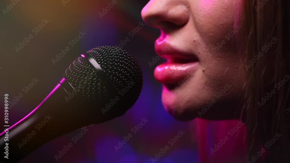 Singing Woman with Microphone. Karaoke bar. Beauty Glamour professional ...