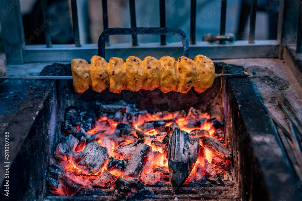 Preparing tandoori momos on the barbecue Stock Photo | Adobe Stock