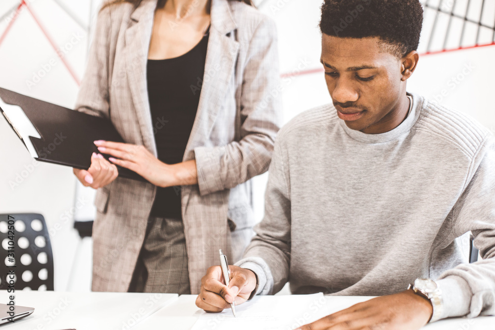 African american man signing contract, black man hand putting signature ...