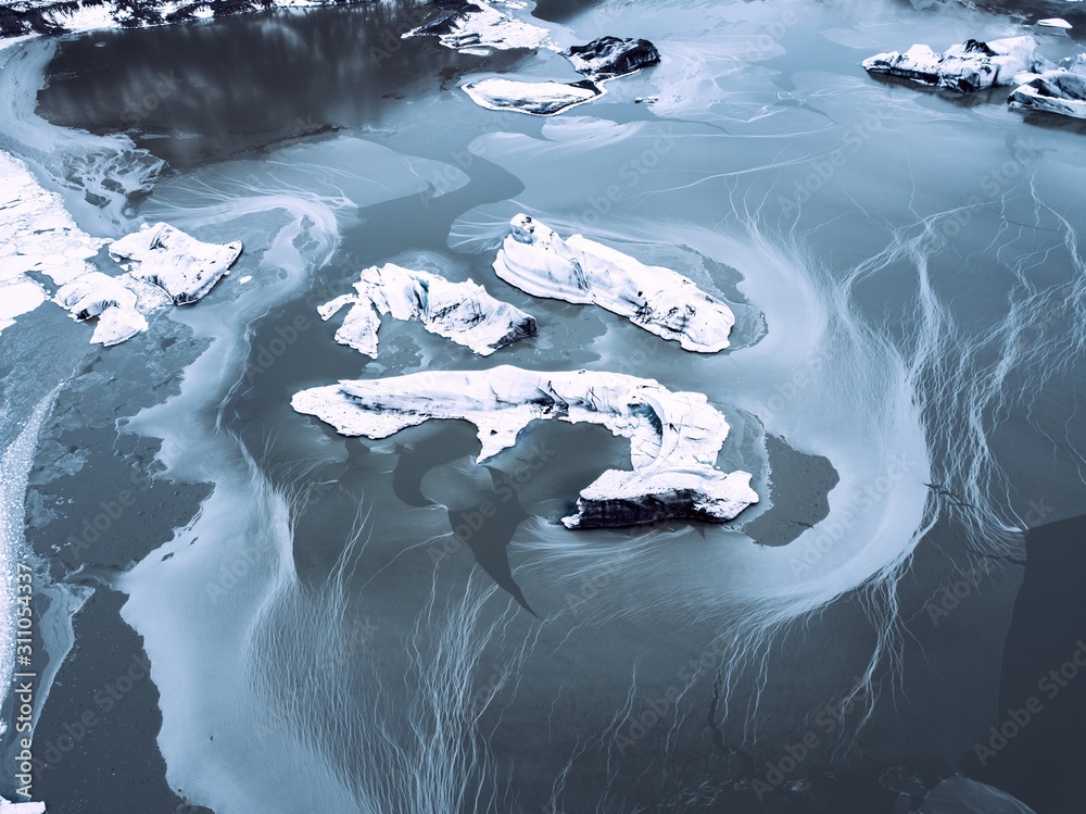 Birds-eye view of the frozen pieces of ice in the middle of the frosty ...