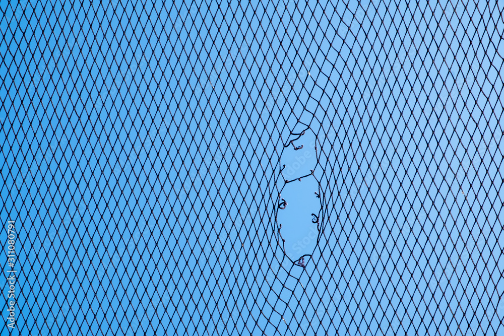 torn fishing net and blue sky Stock Photo | Adobe Stock
