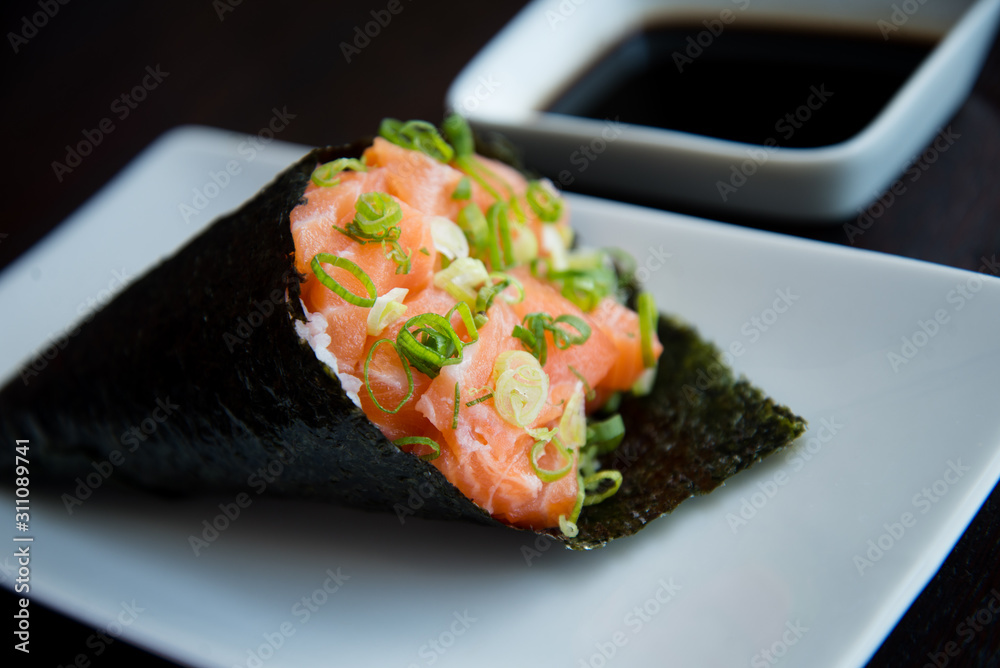 temaki cone-shaped sushi with raw salmon, japanese food, philadelphia ...