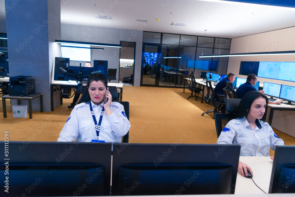 Technical Operator Works at His Workstation with Multiple Displays ...