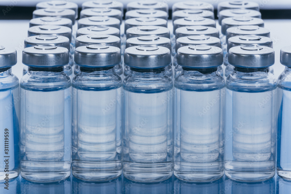Glass medical ampoule vial for injection. Medicine is dry white drug ...
