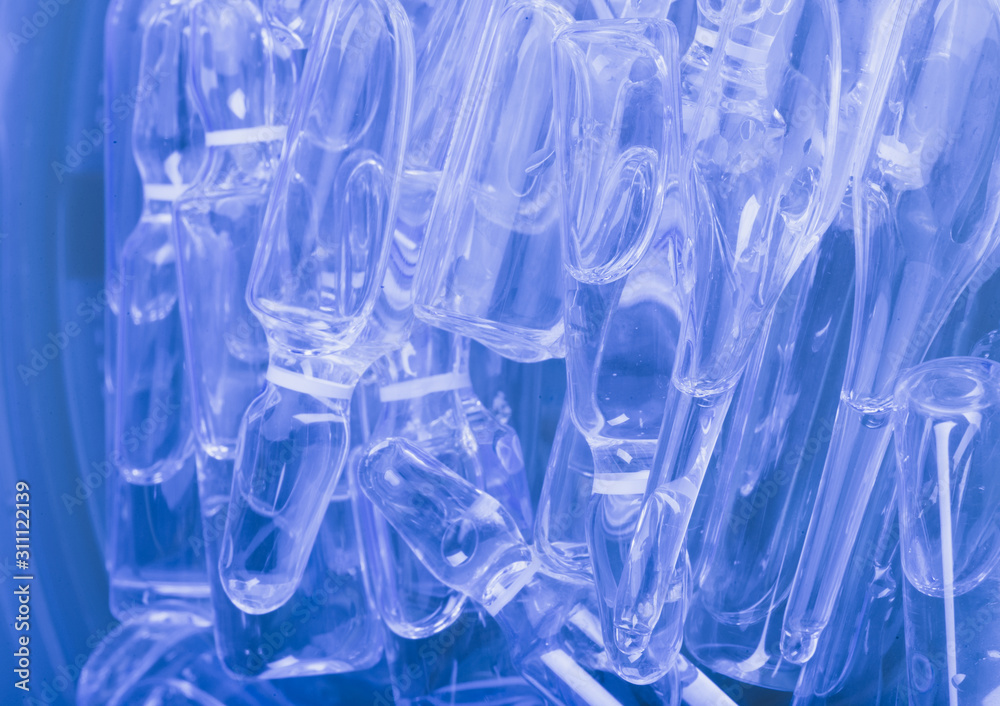 Glass medical ampoule vial for injection. Medicine is liquid sodium ...