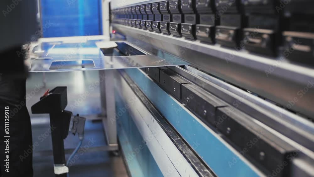 Operator working cut and bending metal sheet by high precision metal ...