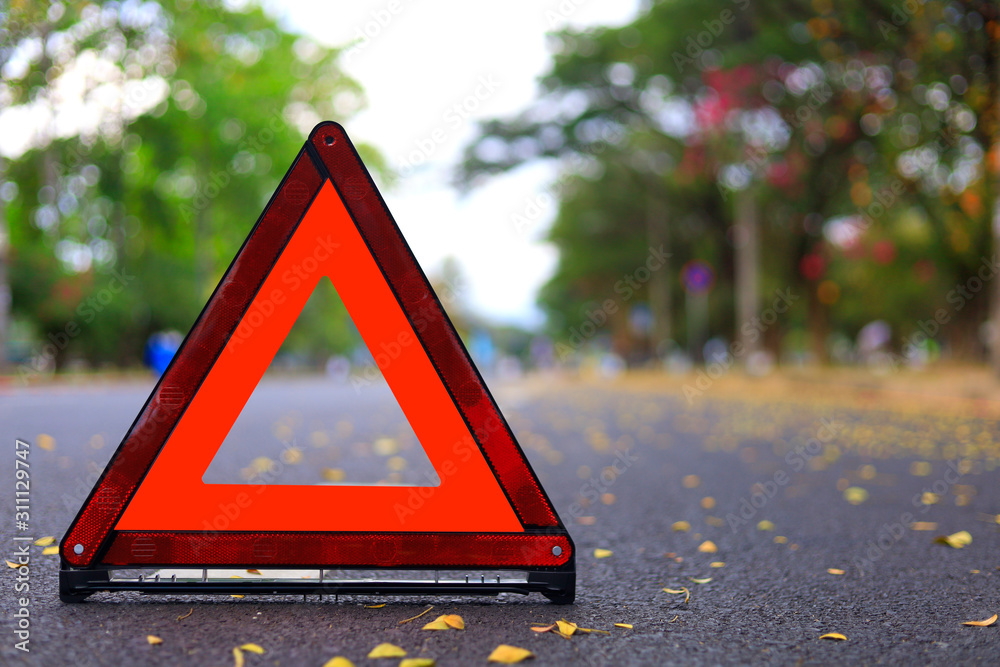 Red triangle, red emergency stop sign, red emergency symbol on road ...