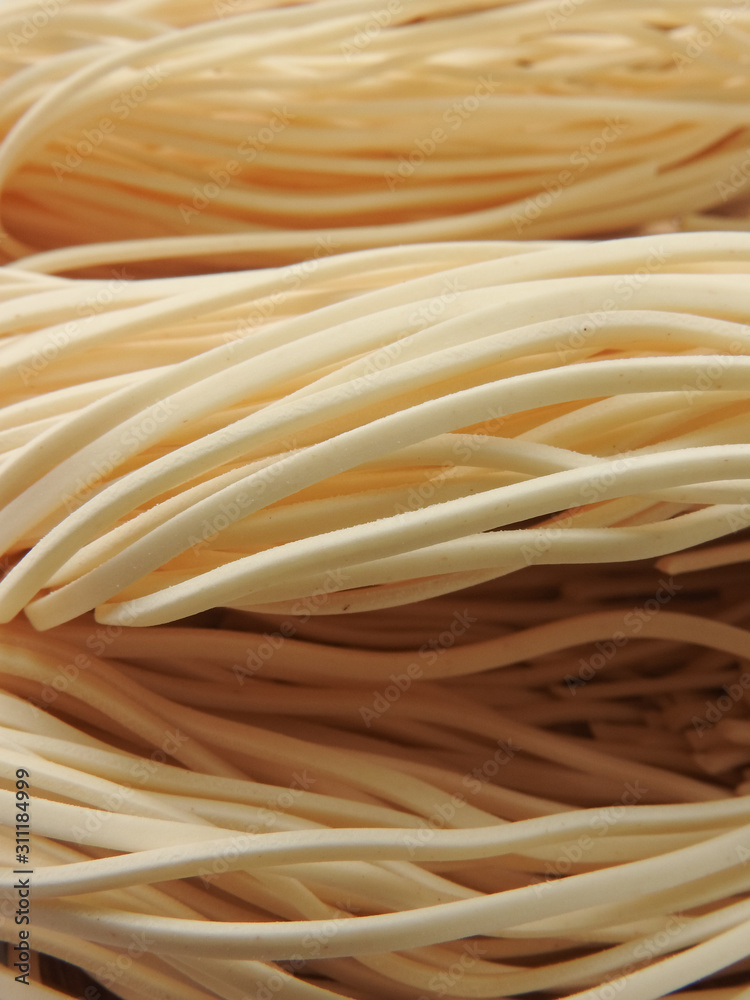Front view of three layer of raw thin noodles full of frame. Food ...