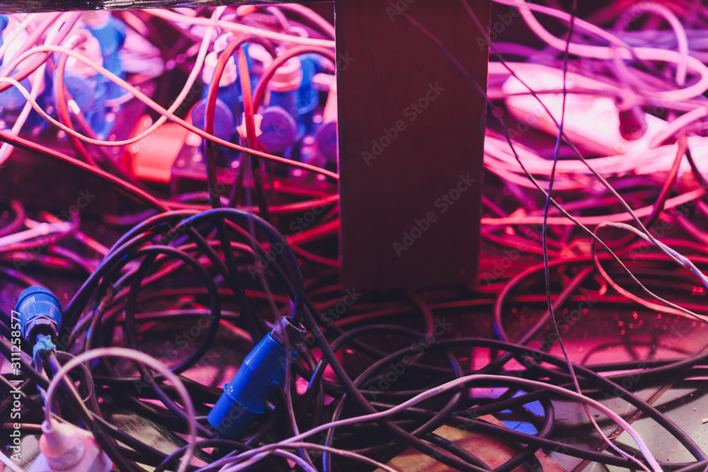 The bunch of electric wires of different colors are very much ...