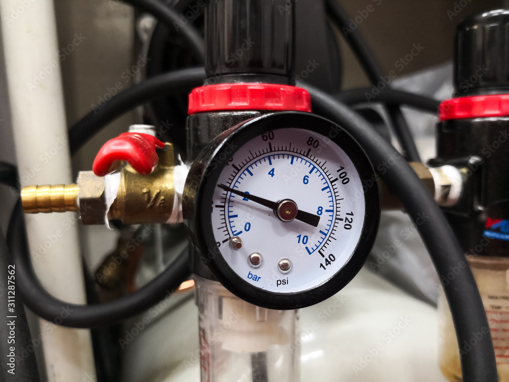 Pressure measurement mechanism (barometer). Pressure valve connected to ...