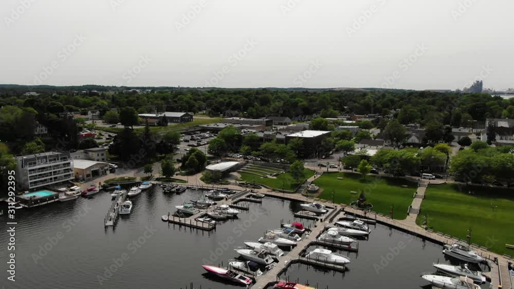 Round Lake in Charlevoix connects to Lake Michigan with boats and sail ...