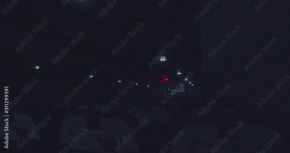 Spooky airplane cabine in the darkness with red toilet sign - Fear of ...