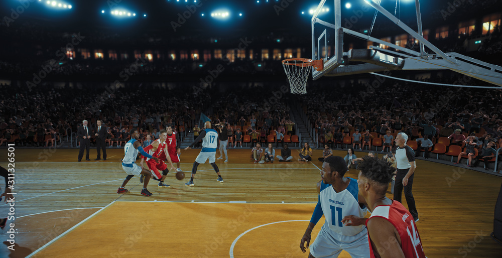 Basketball players on big professional arena during the game. Tense ...