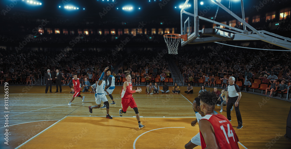 Basketball players on big professional arena during the game. Tense ...