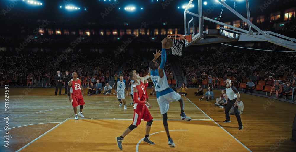Basketball players on big professional arena during the game. Tense ...