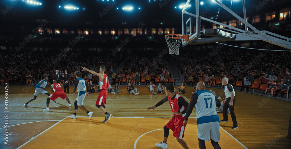 Basketball players on big professional arena during the game. Tense ...