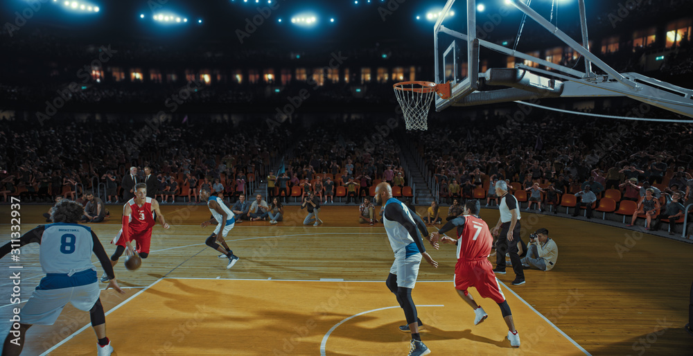 Basketball players on big professional arena during the game. Tense ...