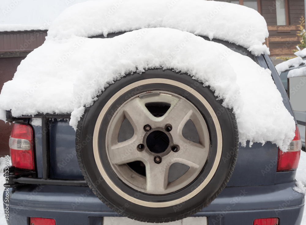 Back view of car with spare wheel. Off-road vehicle with stepney tire ...